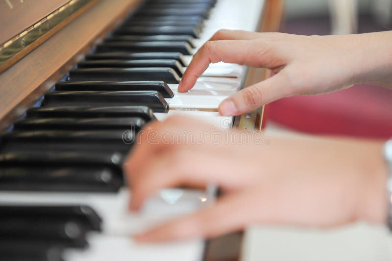Hands playing piano stock image. Image of closeup, human - 94841907