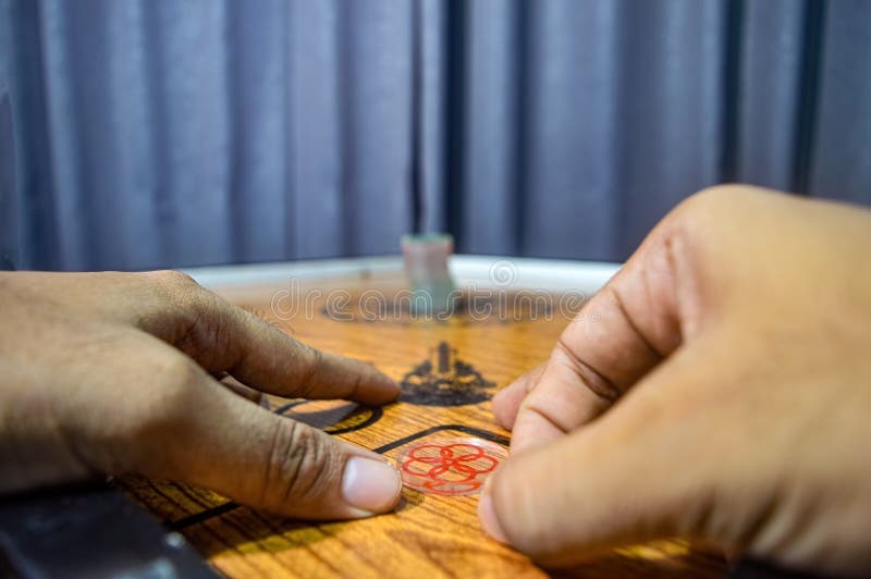 Hands Playing a Traditional Game Called Carom Stock Photo - Image of ...