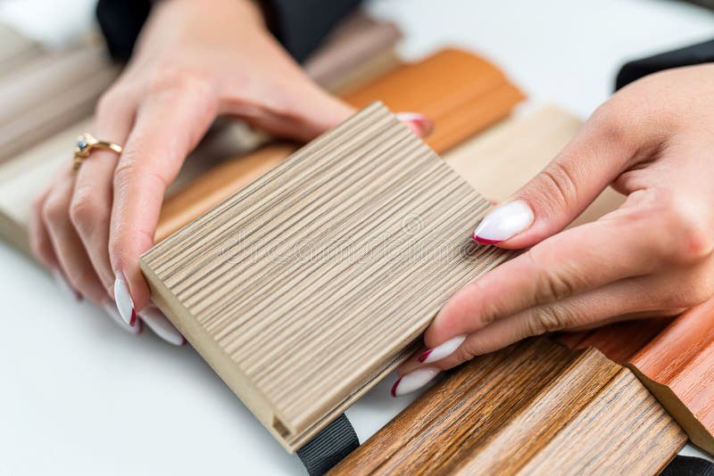 Hands Point Colored Wood Samples Likes and Selects Samples in Wood Sample Catalog for His Sofa ...