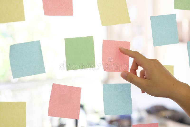 Hands pointing on sticky note paper. Hands pointing on sticky note ...