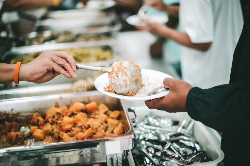 The Hands of the Poor Apply for Food from Rich People Who Donate Food ...