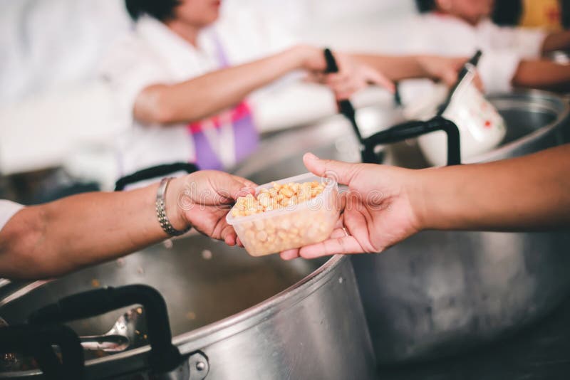 The Hands of the Poor Apply for Food from Rich People Who Donate Food ...