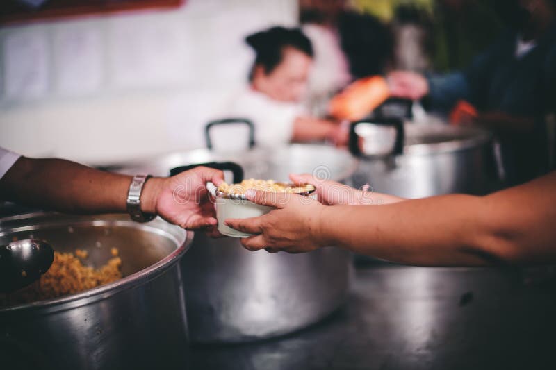 The Hands of the Poor Apply for Food from Rich People Who Donate Food ...