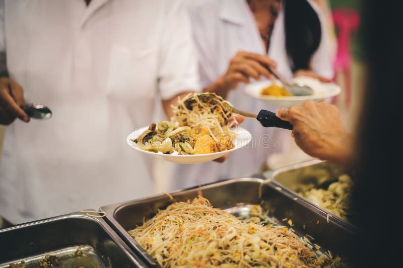 The Hands of the Poor Apply for Food from Rich People Who Donate Food ...