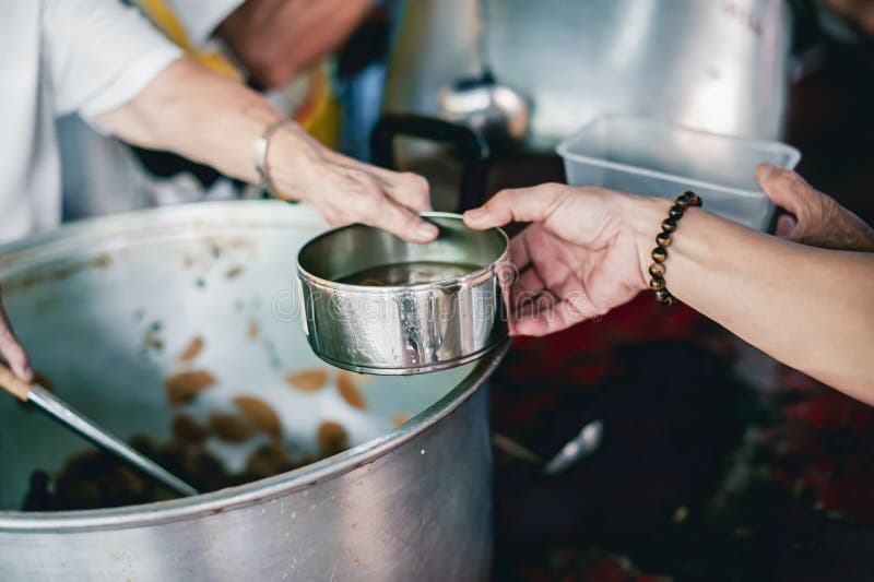 The Hands of the Poor Apply for Food from Rich People Who Donate Food ...
