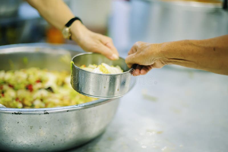 The Hands of the Poor Bring the Container To Fill the Food To Bring ...