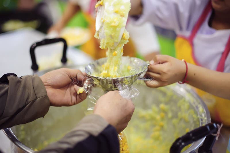 The Hands of the Poor Bring the Container To Fill the Food To Bring ...
