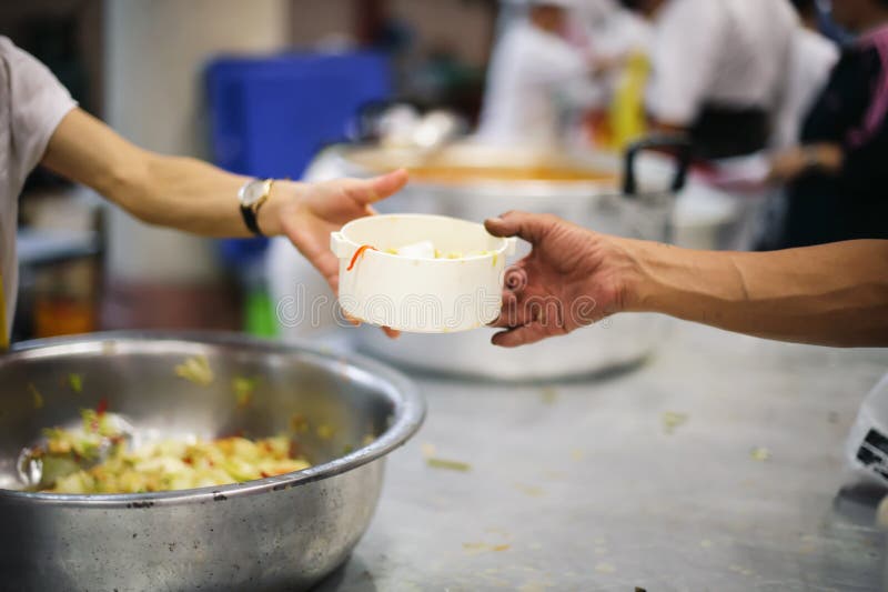 The Hands of the Poor Bring the Container To Fill the Food To Bring ...