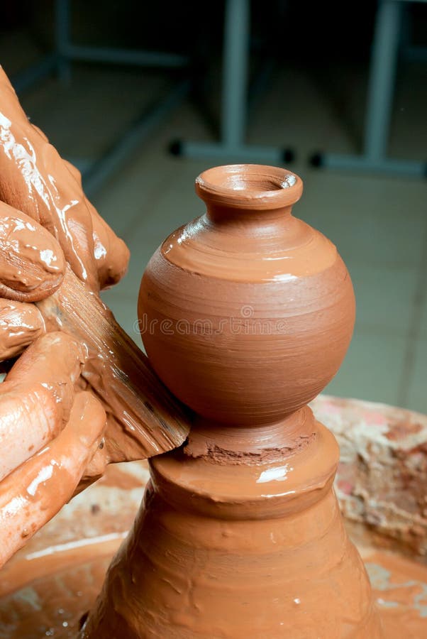 Hands of a Potter, Creating an Earthen Jar on the Circle Stock Image ...
