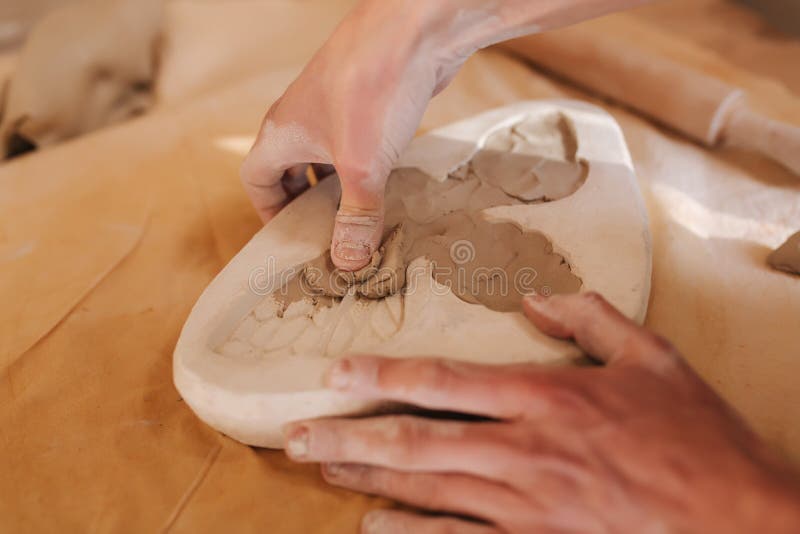 Hands of Potter Fill the Form with a Ceramic in the Shape of a ...