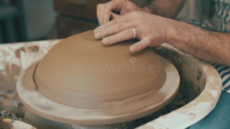 The Hands of a Man Potter Holds and Crumples a Cast of Clay on a ...