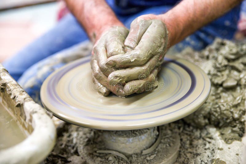 Hands and pottery wheel stock image. Image of clay, earthern - 105938397