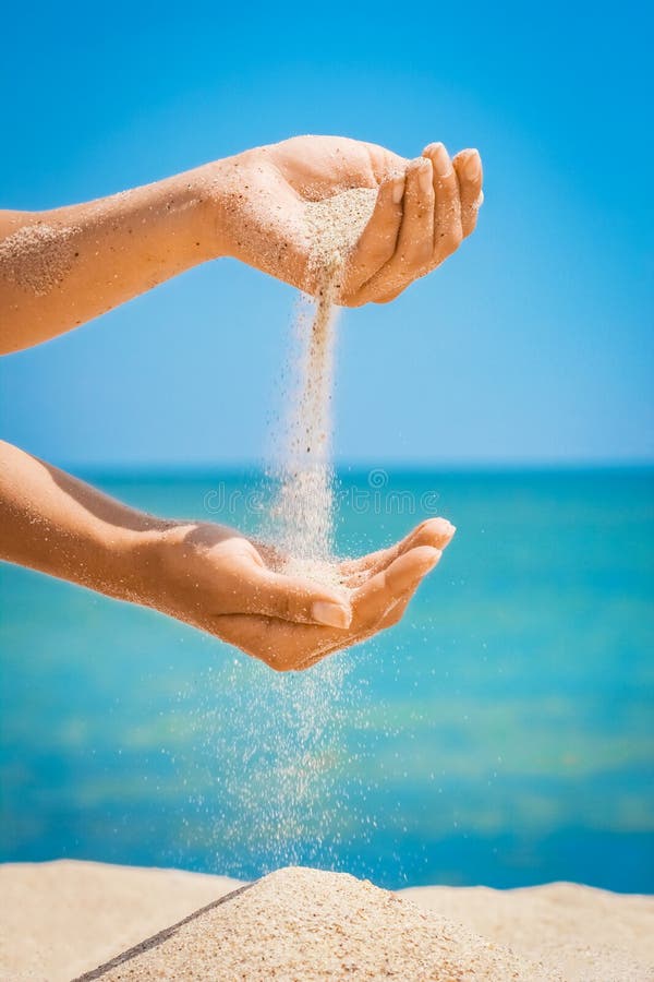 A Hands are Pouring Sand by the Sea Stock Image - Image of pours ...