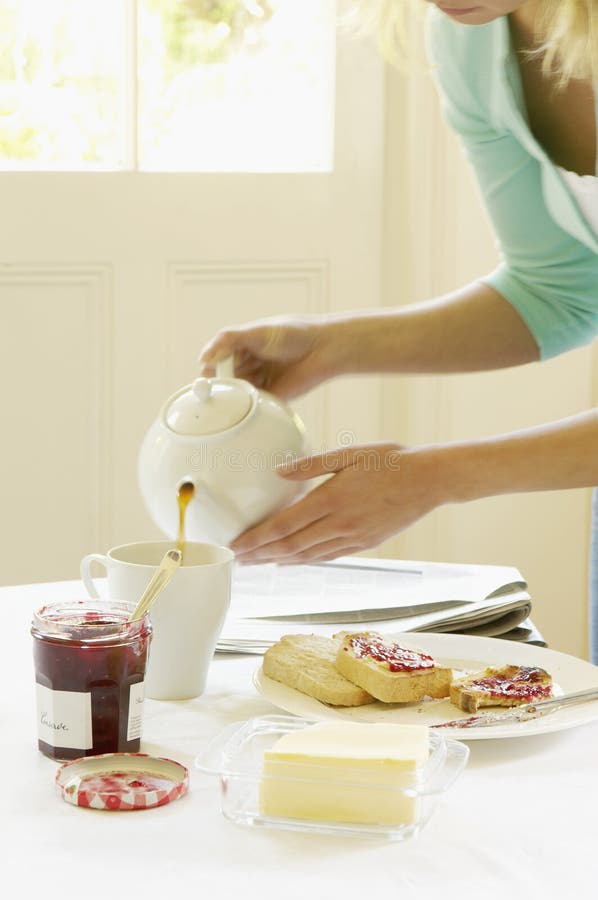 Hands Pouring Tea into Cup on Table Stock Photo - Image of morning ...