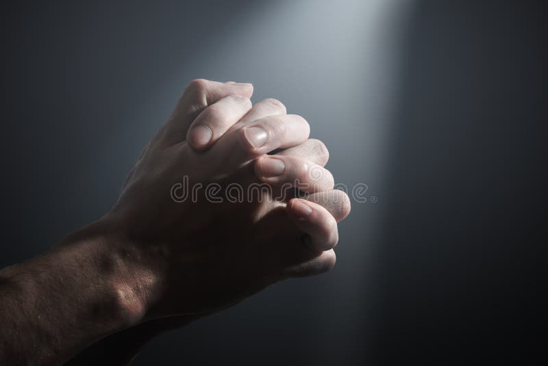 Hands of a Prayer. Light Shining on Praying Man`s Hands. Stock Image ...