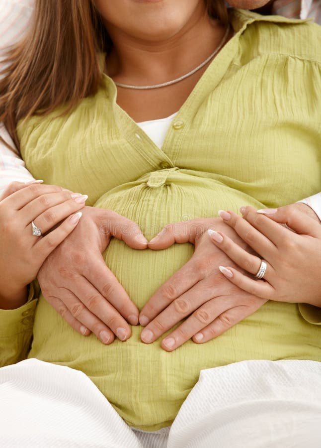 Hands on pregnant belly stock image. Image of color, baby - 13666543