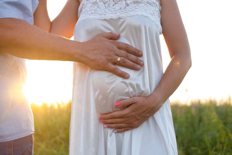 Hands On A Pregnant Belly Husband And Wife Touching Caressing A Big