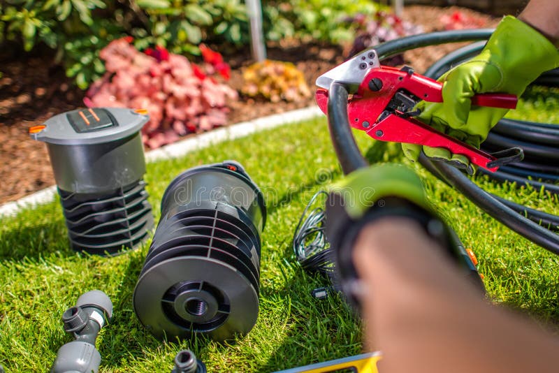 Garden Maintenance with Tools for Irrigation System Installation in a ...