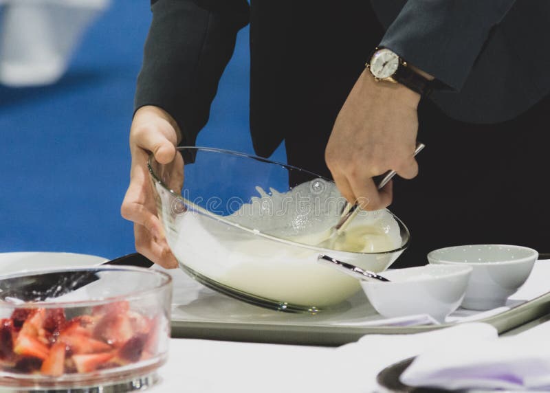 Hands Preparing Cream, Chef Whisking Cream in Kitchen Stock Photo ...