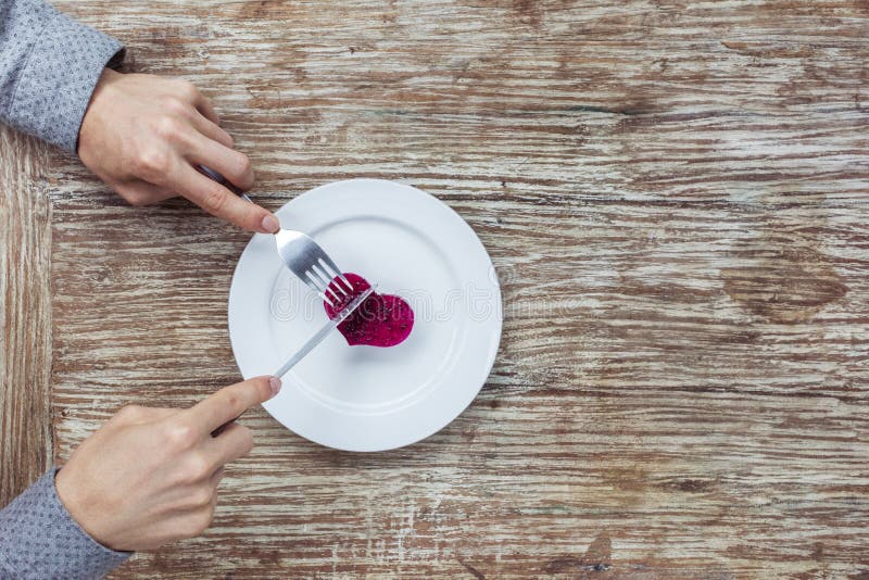 Hands Preparing To Eat Heart on the Plate Stock Image - Image of dragon ...