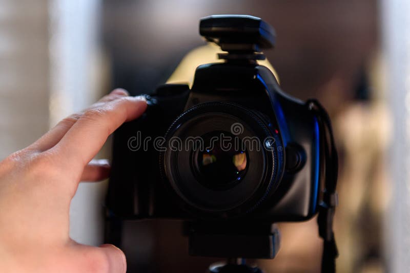 Hands Pressing the Trigger Button on Professional Digital Camera on a ...