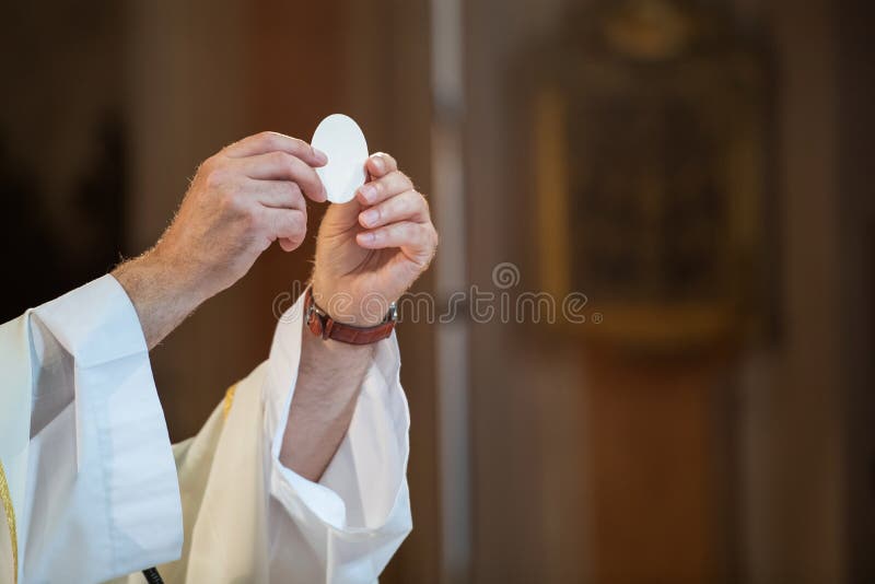 Hands of a Priest Raise a Chalice Stock Photo - Image of eucharist ...