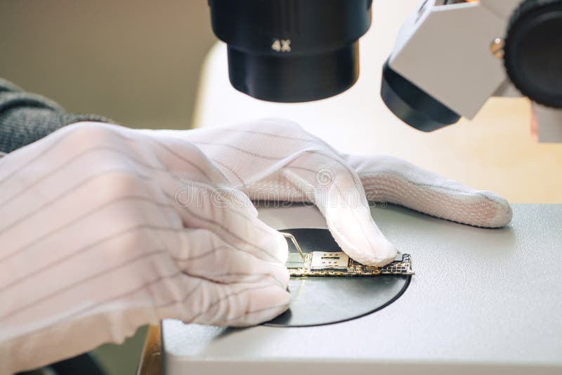 Hands of Professional Tech Repairing Small Computer Components on ...