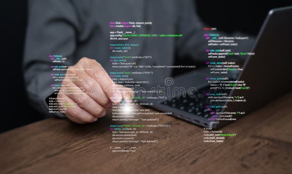 Hands of a Programmer Types on a Laptop Displaying Programming Code ...