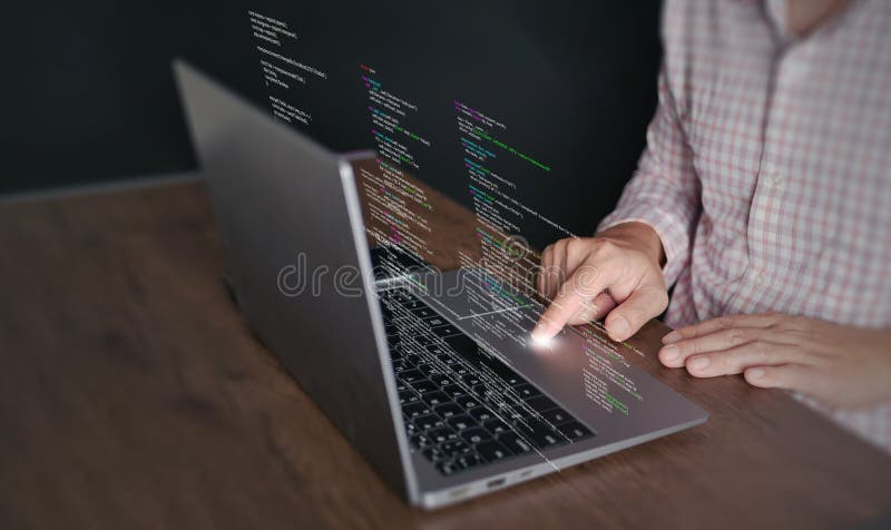 Hands of a Programmer Types on a Laptop Displaying Programming Code ... Hands of a Programmer Types on a Laptop Displaying Programming Code ...