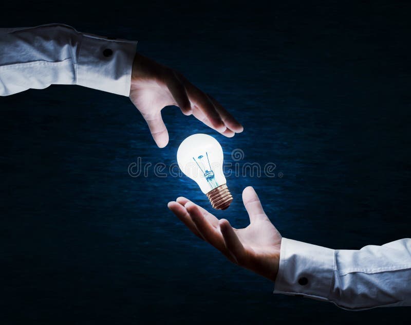 Hands protect light bulb. stock photo. Image of invention - 112564952