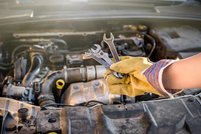 Hands in Protective Gloves with Spanners Against Car Engine Stock Photo ...