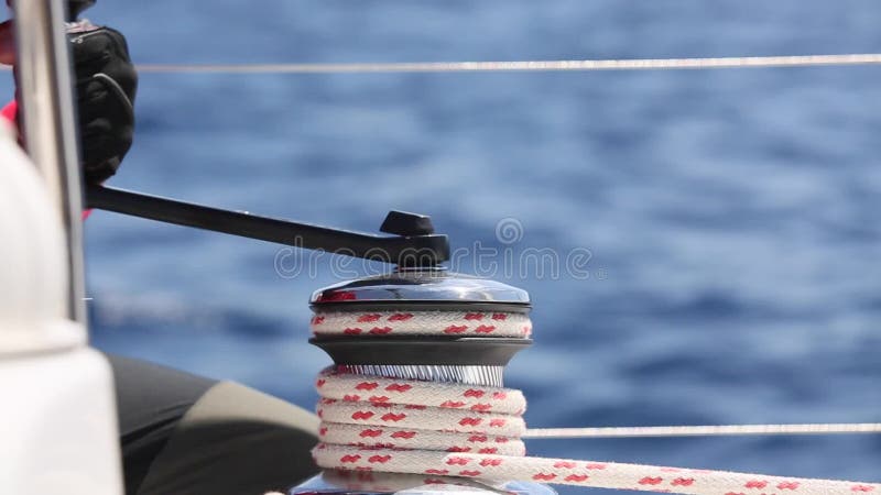 Hands Pulling Ropes, Winding Sheets Around Winches Close-up. Sailor S ...