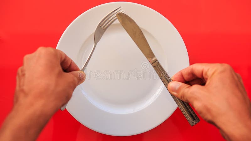 Hands Put Fork Knife Crosswise on Plate on Red Table Stock Footage ...
