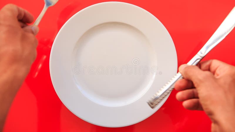 Hands Put Fork Knife Crosswise on Plate on Red Table Stock Footage ...