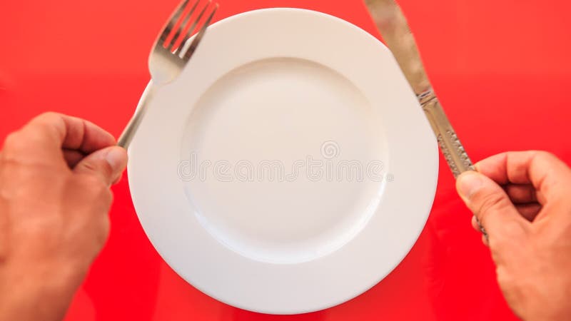 Hands Put Fork Knife Crosswise on Plate on Red Table Stock Footage ...