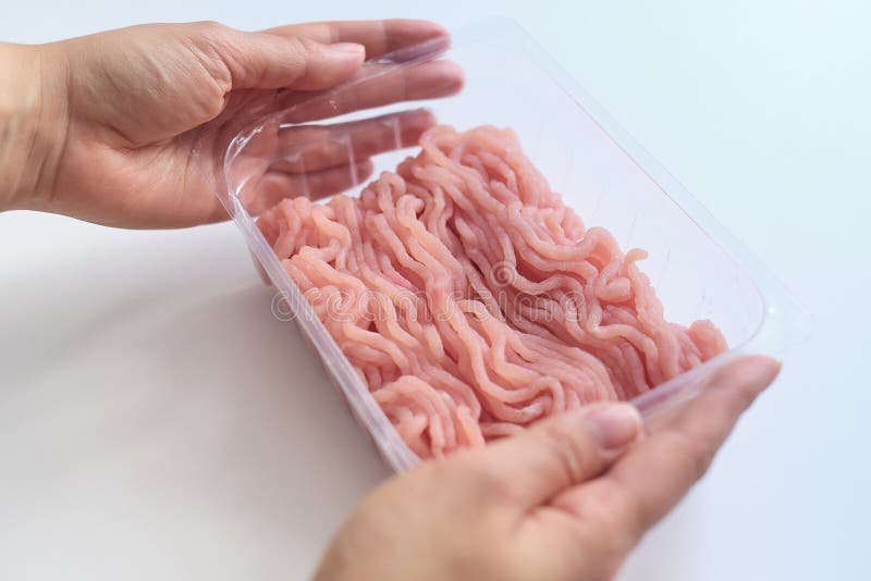 Hands Put on a White Table a Plastic Package with Fresh Minced Meat ...
