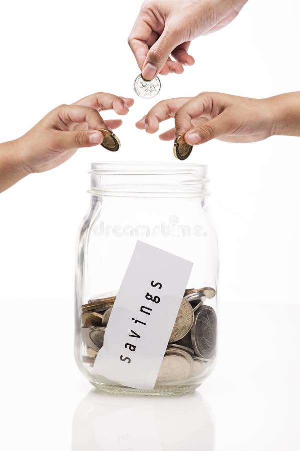 Hands Putting Coin into Glass Bottle, Saving Concept Stock Photo ...