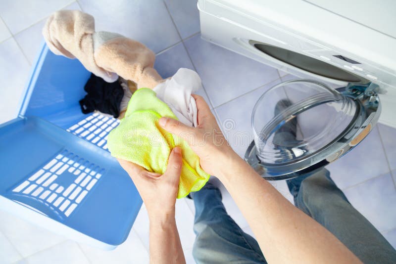 Hands Putting Laundry in the Washing Machine Stock Photo - Image of ...