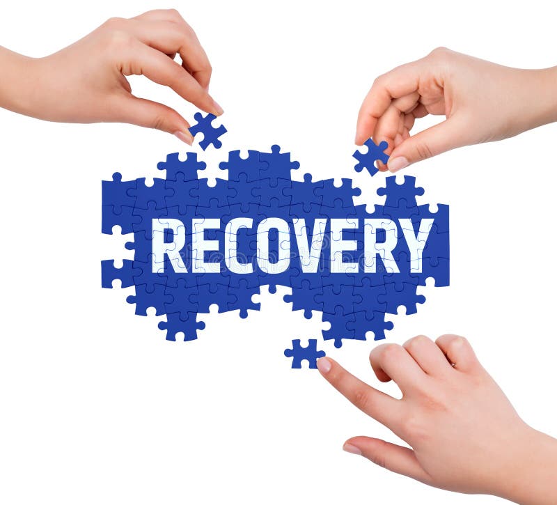 Hands with Puzzle Making RECOVERY Word Stock Photo - Image of ...