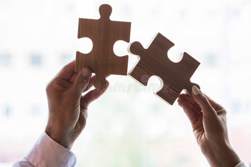 Hands with puzzle pieces stock image. Image of female - 189404749
