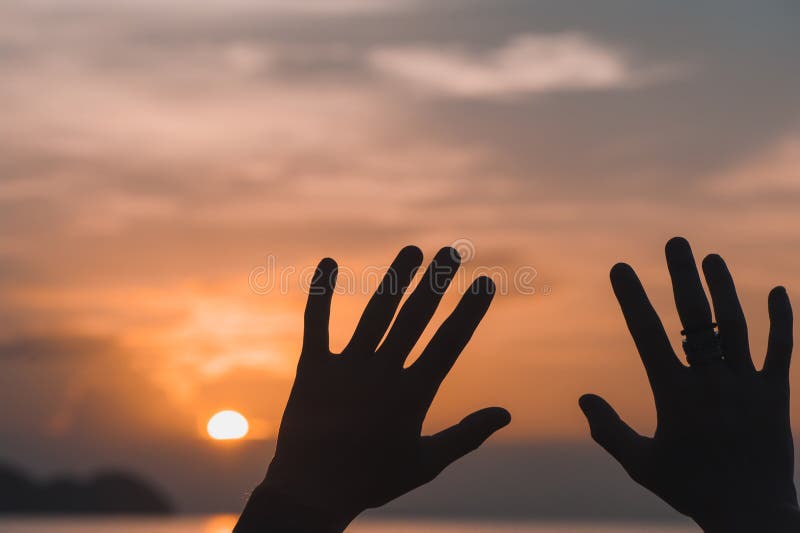 Hands Raised Against Sunset Sky Stock Photo - Image of hands, raised ...