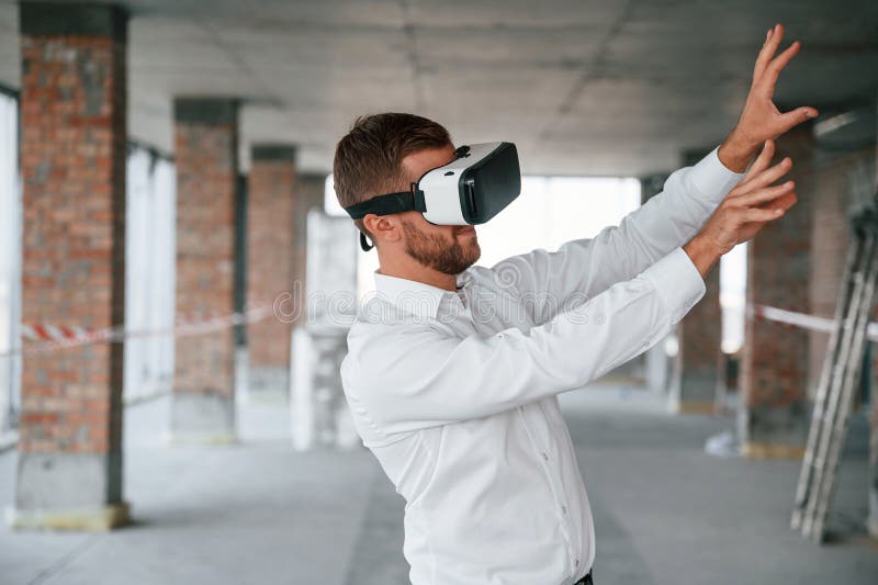 Hands Raised Up. Man in Formal Clothes is Playing VR Game in the ...