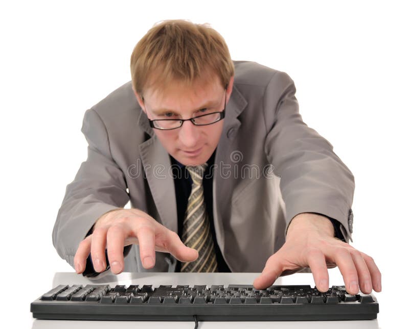Man with Glasses is Typing on a Keyboard while Sitting in Front of a ...