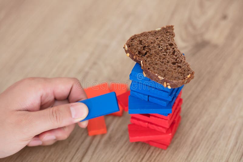 Hands Remove the Building Blocks that Hold the Slices of Bread Stock ...
