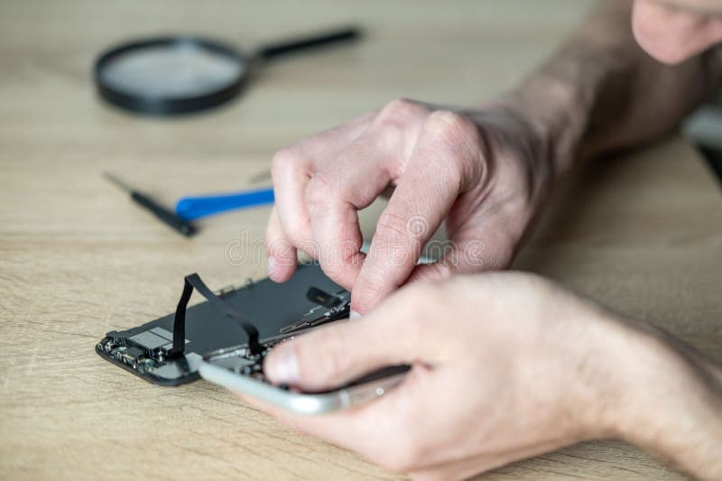 Hands Repairing Smartphone Hardware with Small Tools. Mobile Phone ...