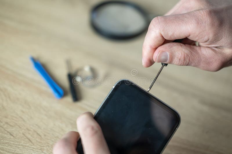 Hands Repairing Smartphone Hardware with Small Tools. Mobile Phone ...