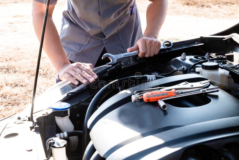 The Hands of the Repairman are Checking the Order of the Engine Using ...