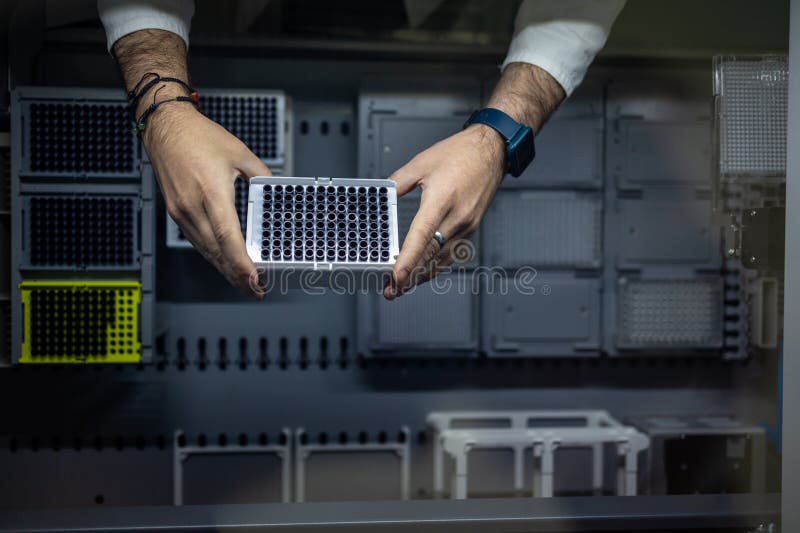 Hands of a Researcher Carrying Out Research Experiment in a Chemistry ...