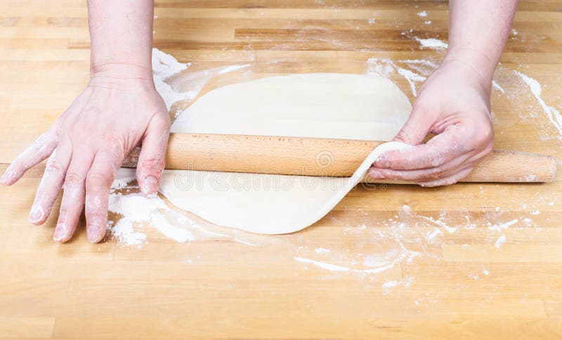Hands Roll Out the Dough with a Rolling Pin Stock Image - Image of ...