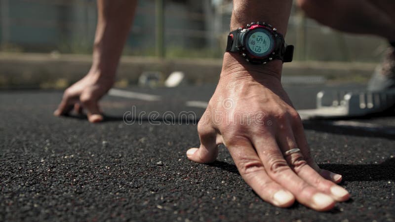 Hands of a Runner on the Surface of a Race Track Stock Video - Video of ...